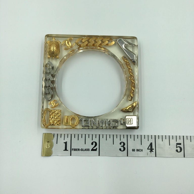 Chanel Square Lucite Bangle with Gold and Silver Inlaid Charms For Sale ...