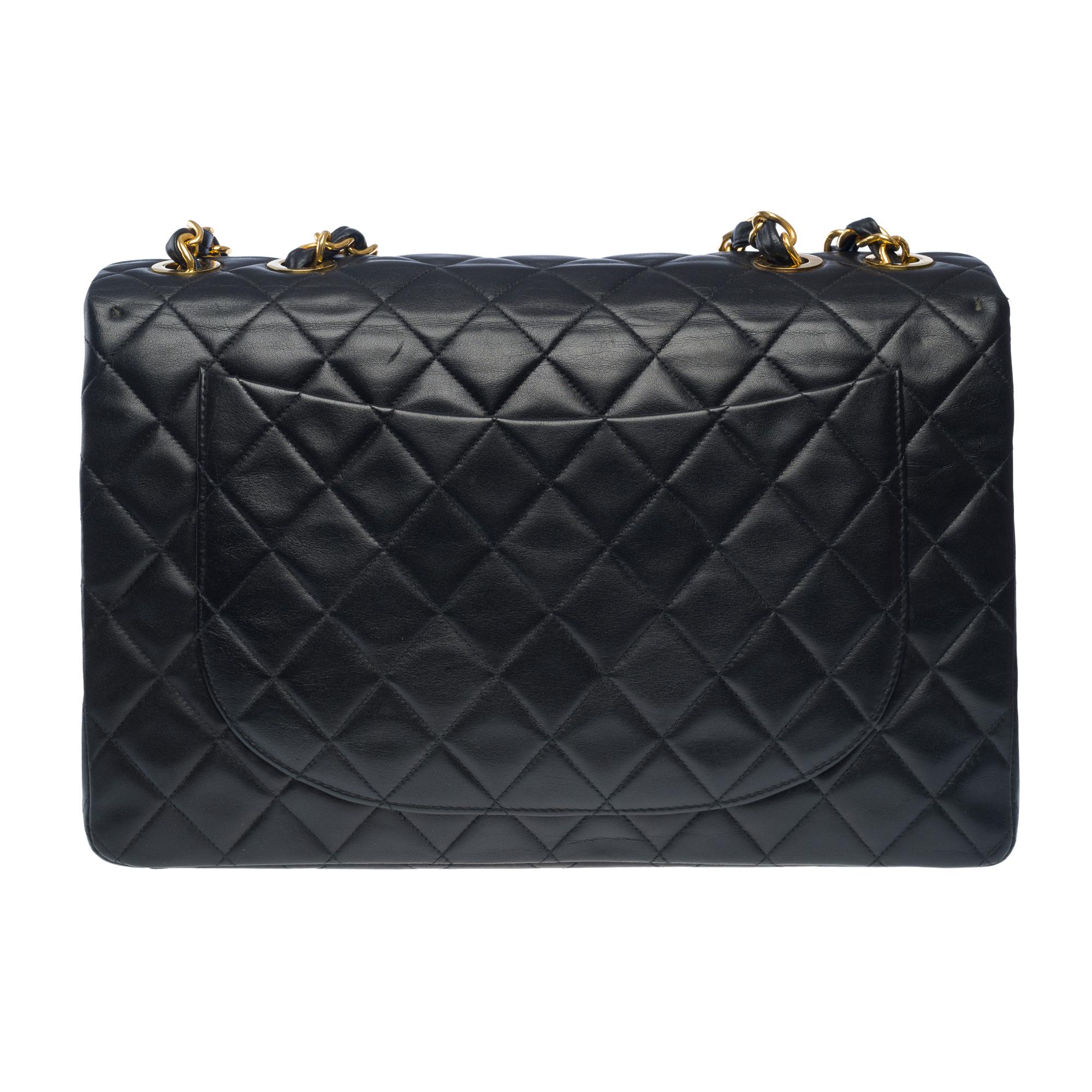 Chanel Timeless Maxi Jumbo flap shoulder bag in black quilted lambskin ...