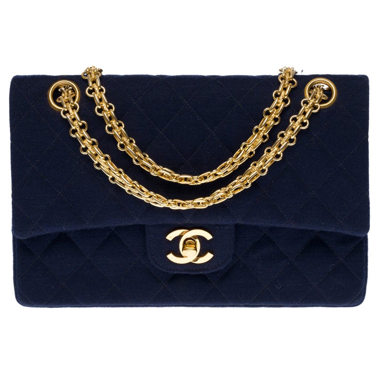 Chanel Timeless shoulder bag in navy blue quilted jersey with gold ...