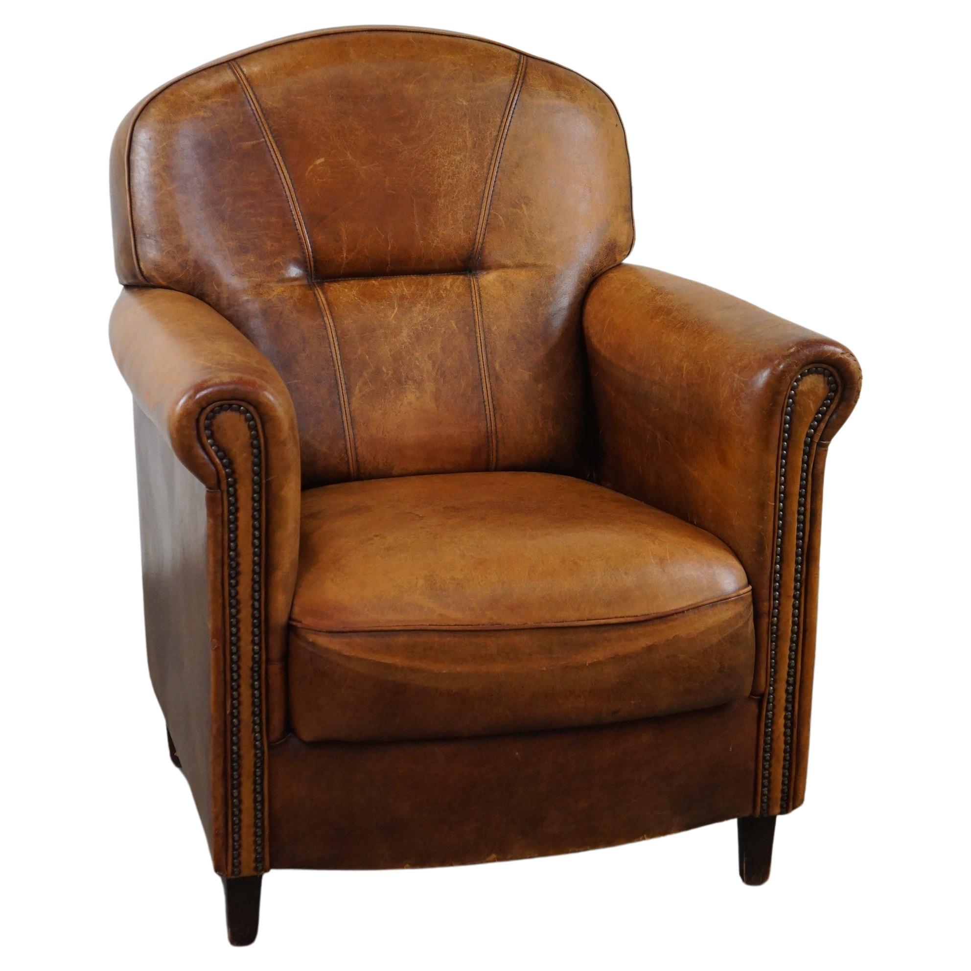 Charming and rugged sheepskin leather armchair, large model For Sale at ...
