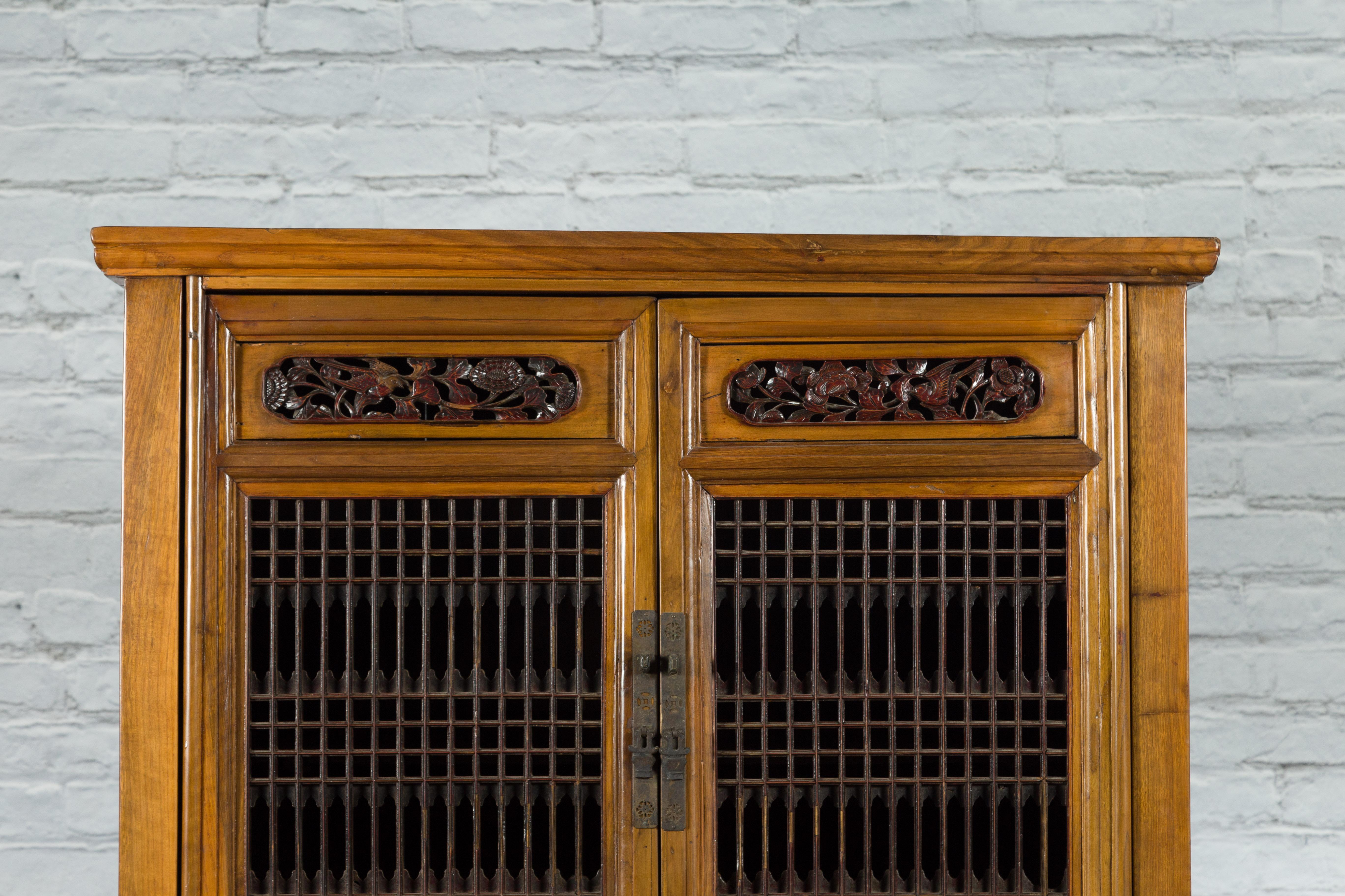 Chinese Early 20th Century Tall Cabinet with Fretwork Motifs and Carved ...
