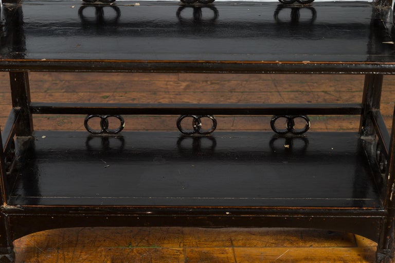 Chinese Qing Dynasty 19th Century Bookcase with Open Shelves and Ring Motifs For Sale at 1stDibs