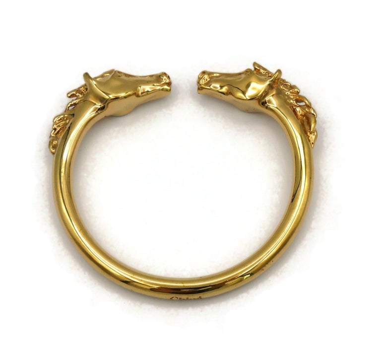 CHLOE Gold Tone Double Horse Head Bangle Bracelet For Sale at 1stDibs