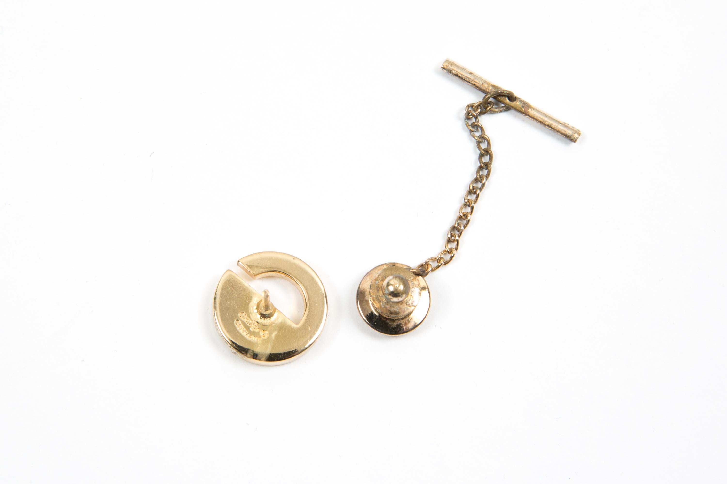Christian Dior Gold Tone Tie Round Pin For Sale at 1stDibs