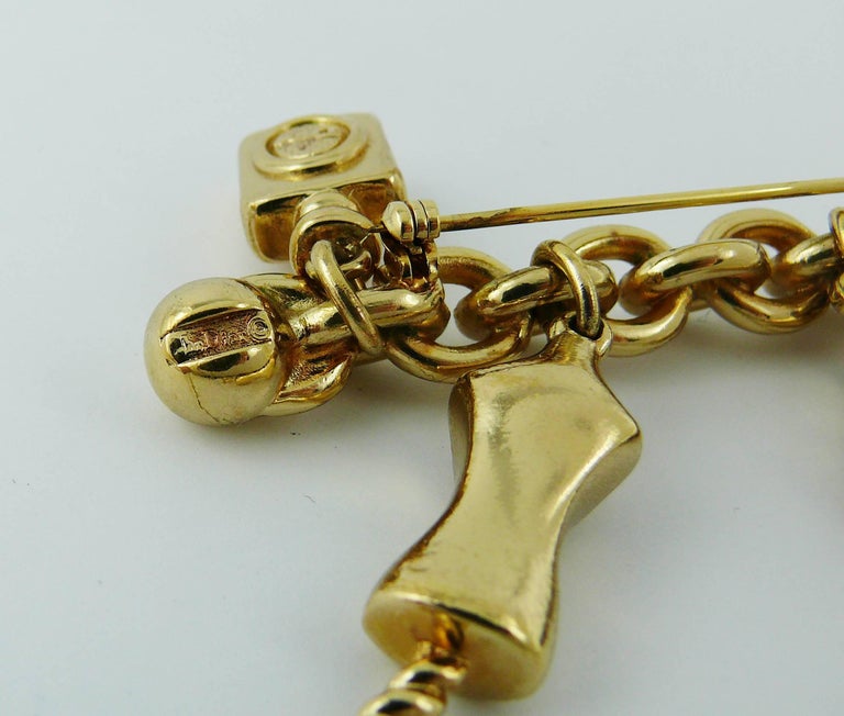 Christian Dior Gold Toned Brooch with Charms at 1stDibs