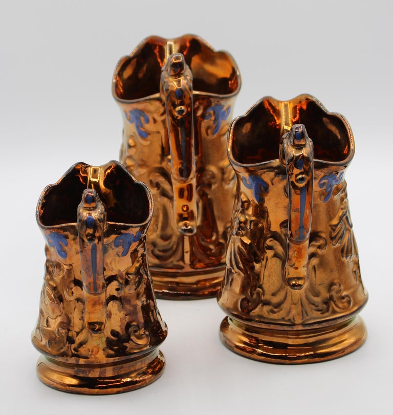 Circa 1860s Graduated Set of Copper Luster Pitchers For Sale at 1stDibs