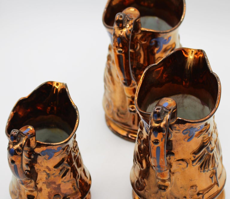 Circa 1860s Graduated Set of Copper Luster Pitchers For Sale at 1stDibs