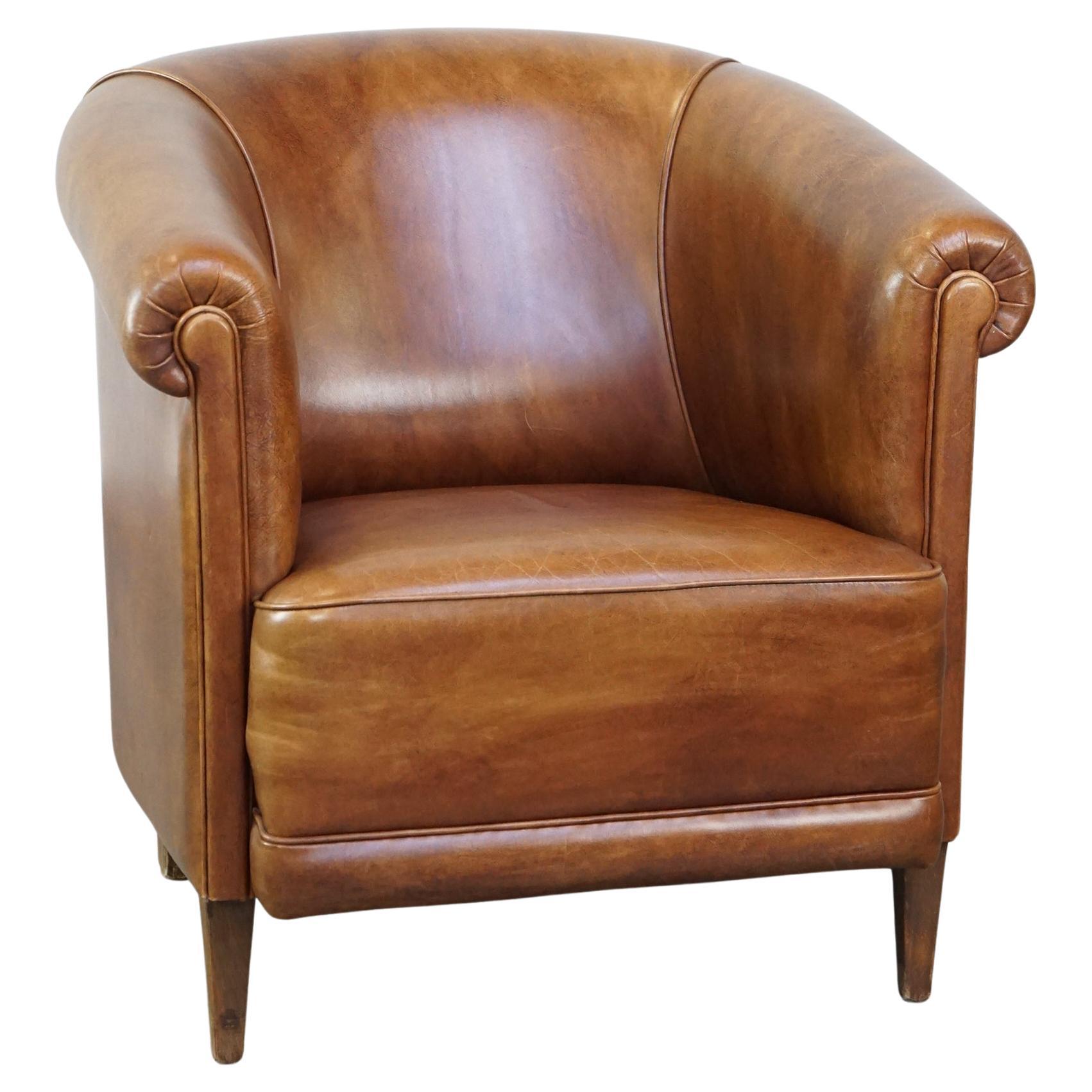 Cognac colored club chair made of cowhide, in very good condition For ...