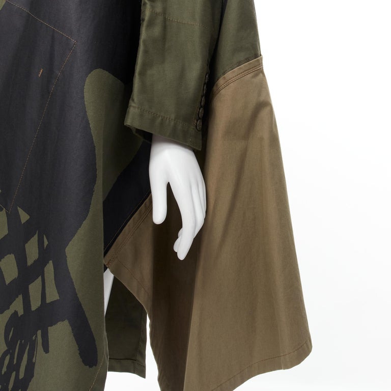 COMME DES GARCONS 2009 Runway green abstract bird deconstructed trench ...