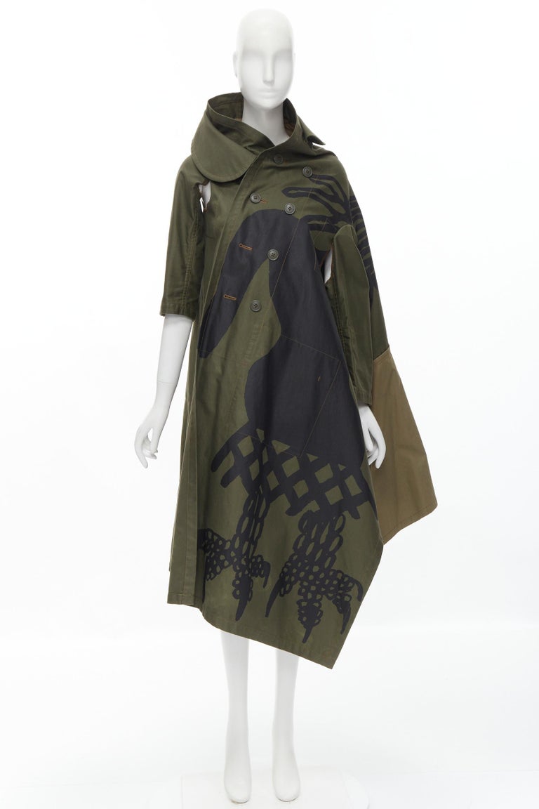 COMME DES GARCONS 2009 Runway green abstract bird deconstructed trench ...