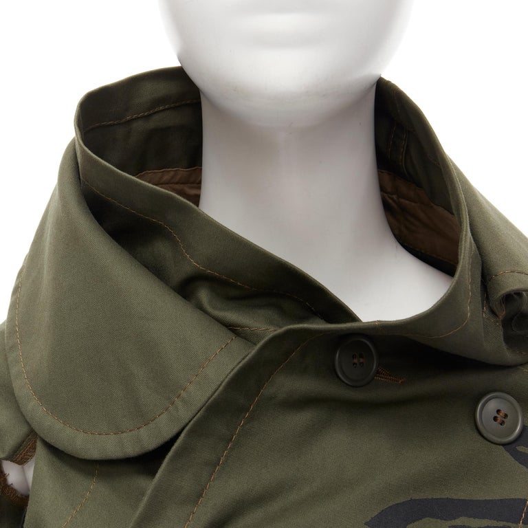 COMME DES GARCONS 2009 Runway green abstract bird deconstructed trench ...