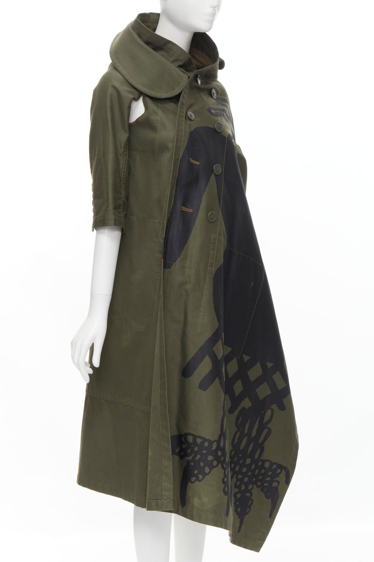 COMME DES GARCONS 2009 Runway green abstract bird deconstructed trench ...
