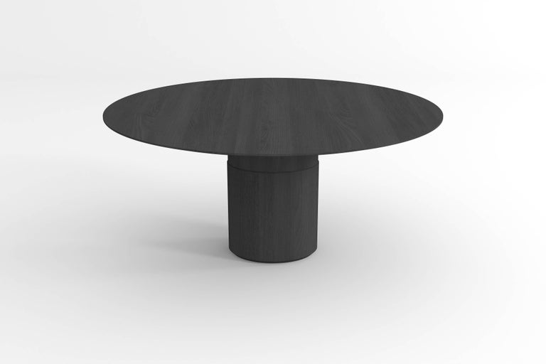 Contemporary round dining table, black ash wood, central leg, Belgian ...