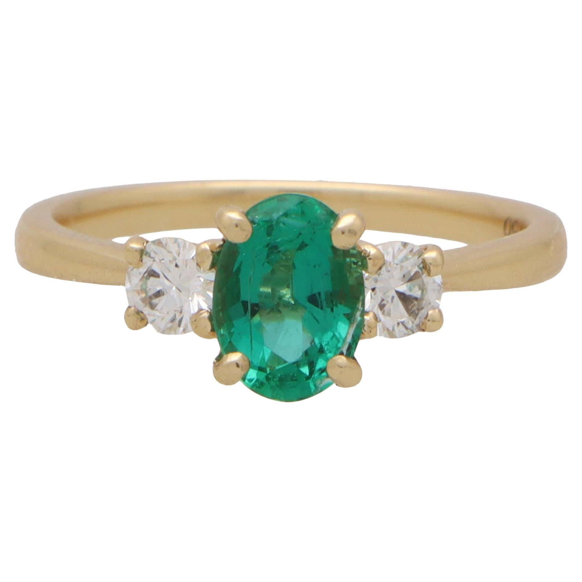 Contemporary Oval Emerald and Round Cut Diamond Three Stone Rin in 18k ...