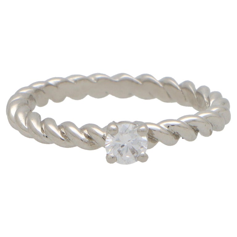 Contemporary Round Cut Diamond Solitaire Ring with Twisted Band in ...