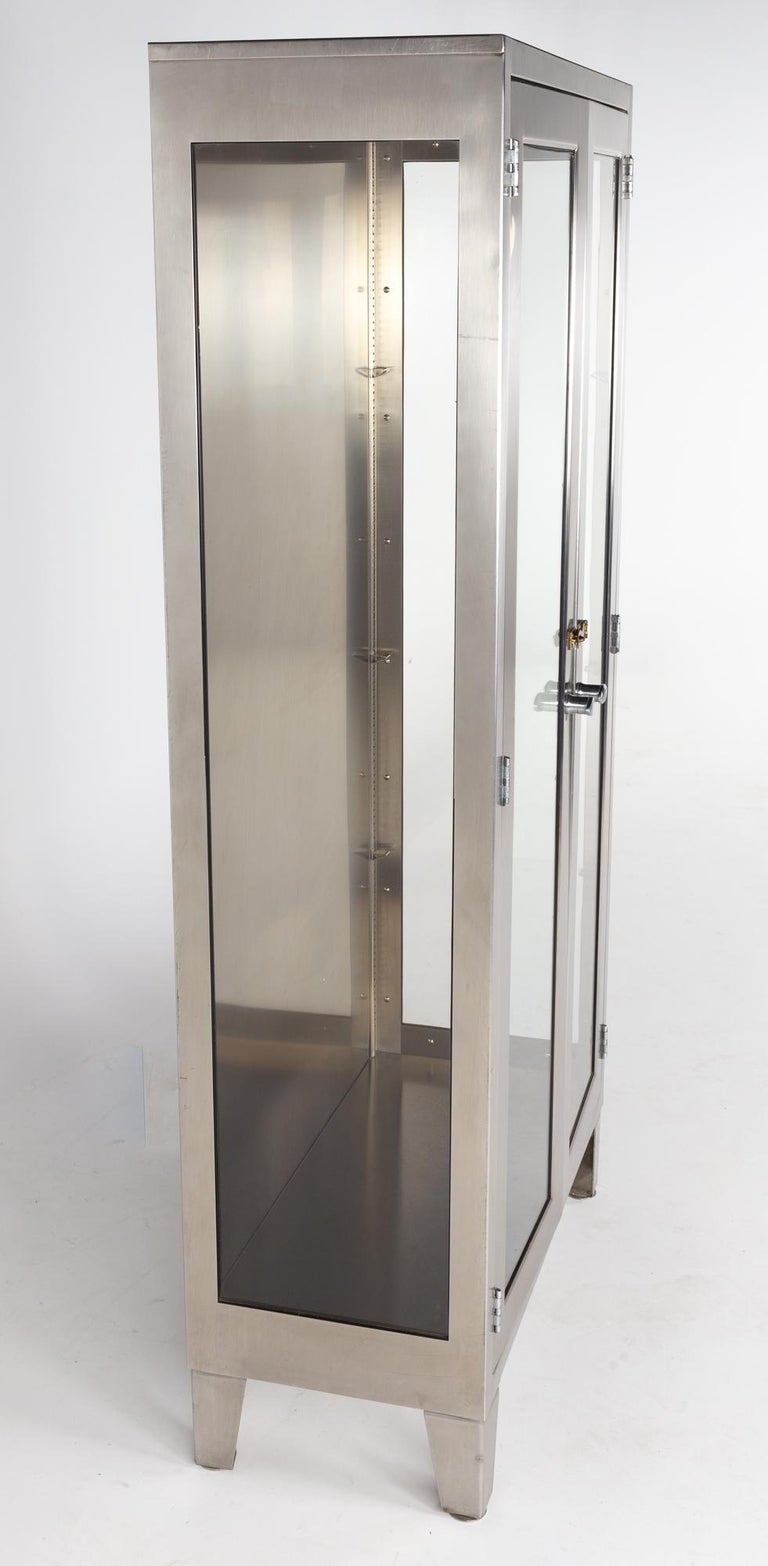 Contemporary Stainless Steel Display Cabinet with Glass Shelves at 1stDibs