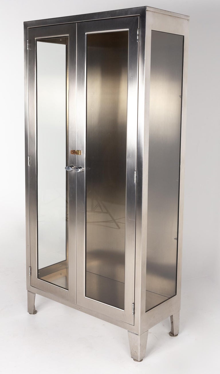 Contemporary Stainless Steel Display Cabinet with Glass Shelves at 1stDibs