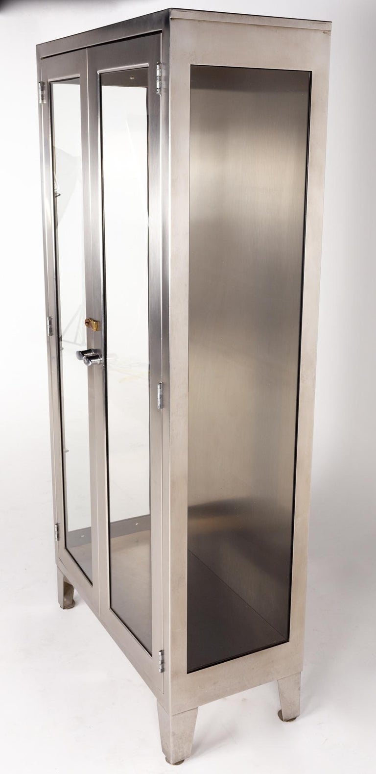 Contemporary Stainless Steel Display Cabinet with Glass Shelves at 1stDibs