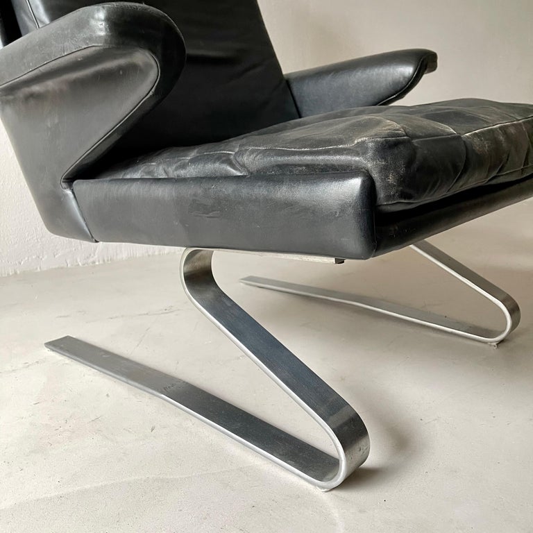COR Swing Designer Armchair in Leather with Ottoman For Sale at 1stDibs
