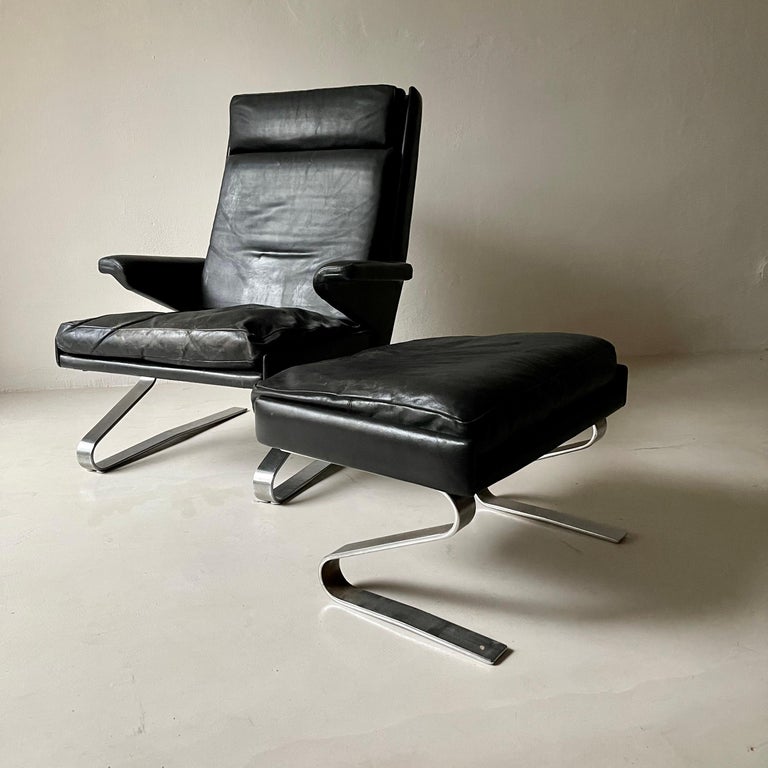 COR Swing Designer Armchair in Leather with Ottoman For Sale at 1stDibs