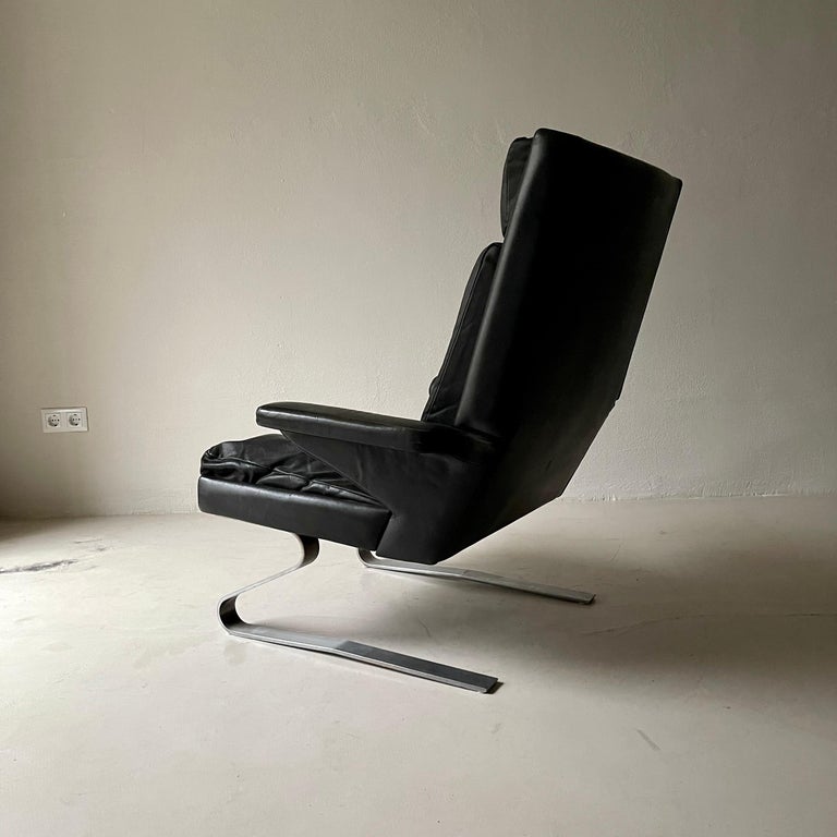 COR Swing Designer Armchair in Leather with Ottoman For Sale at 1stDibs