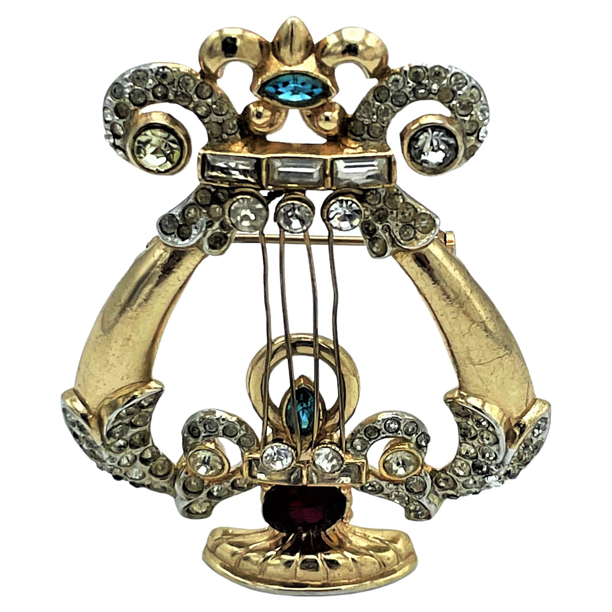 Coro brooch in the form of a string instrument, rhinestones, g. plated ...