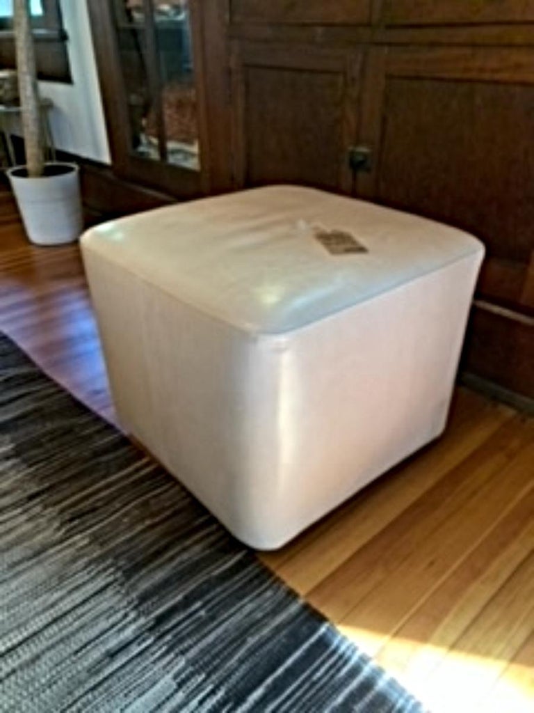 Cream Leather Ottoman with Caster Wheels For Sale at 1stDibs