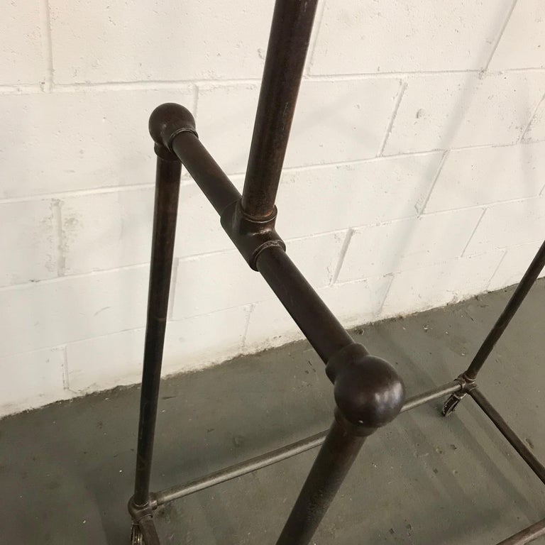 Deco Era Tubular Iron Rolling Garment Rack at 1stDibs