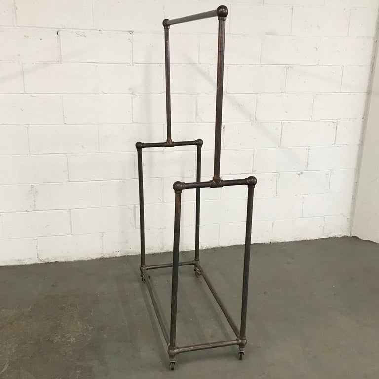 Deco Era Tubular Iron Rolling Garment Rack at 1stDibs