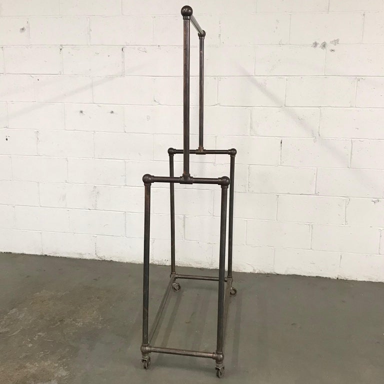 Deco Era Tubular Iron Rolling Garment Rack at 1stDibs