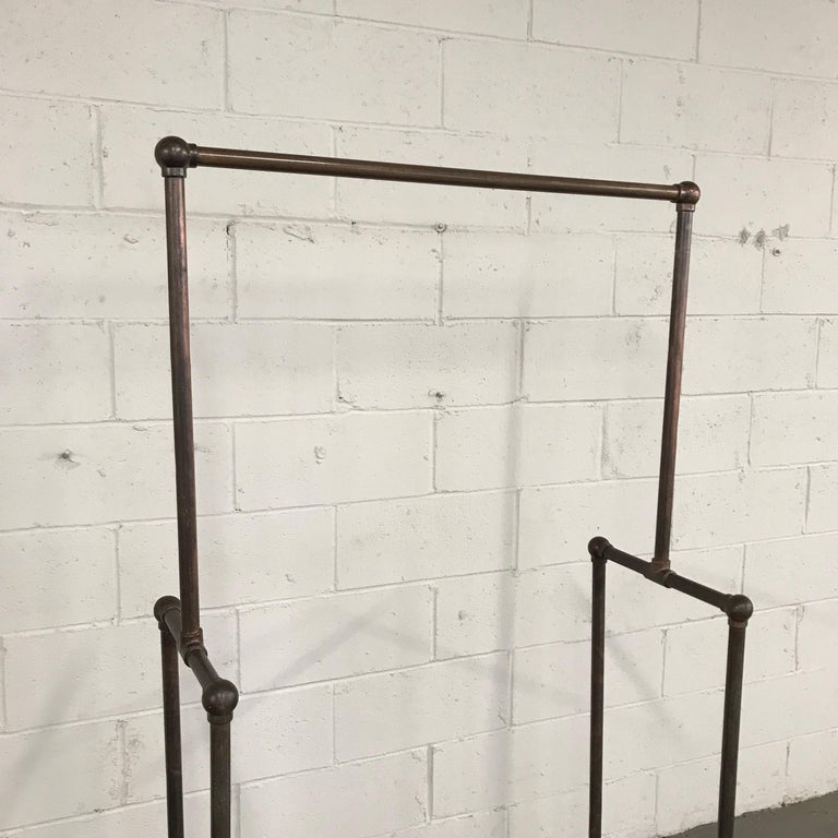 Deco Era Tubular Iron Rolling Garment Rack at 1stDibs