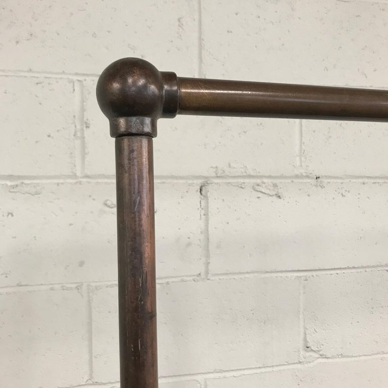 Deco Era Tubular Iron Rolling Garment Rack at 1stDibs