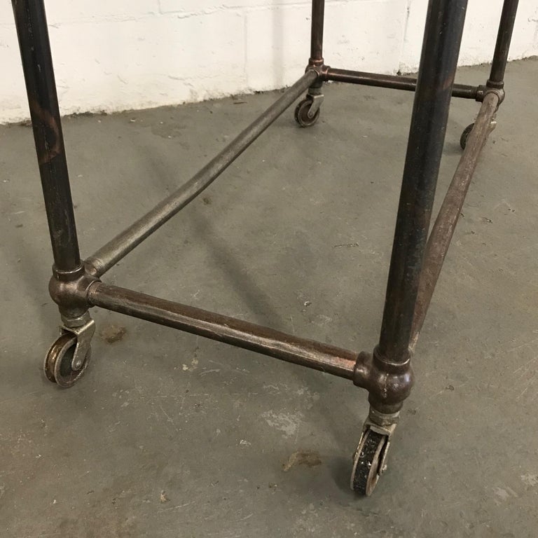 Deco Era Tubular Iron Rolling Garment Rack at 1stDibs
