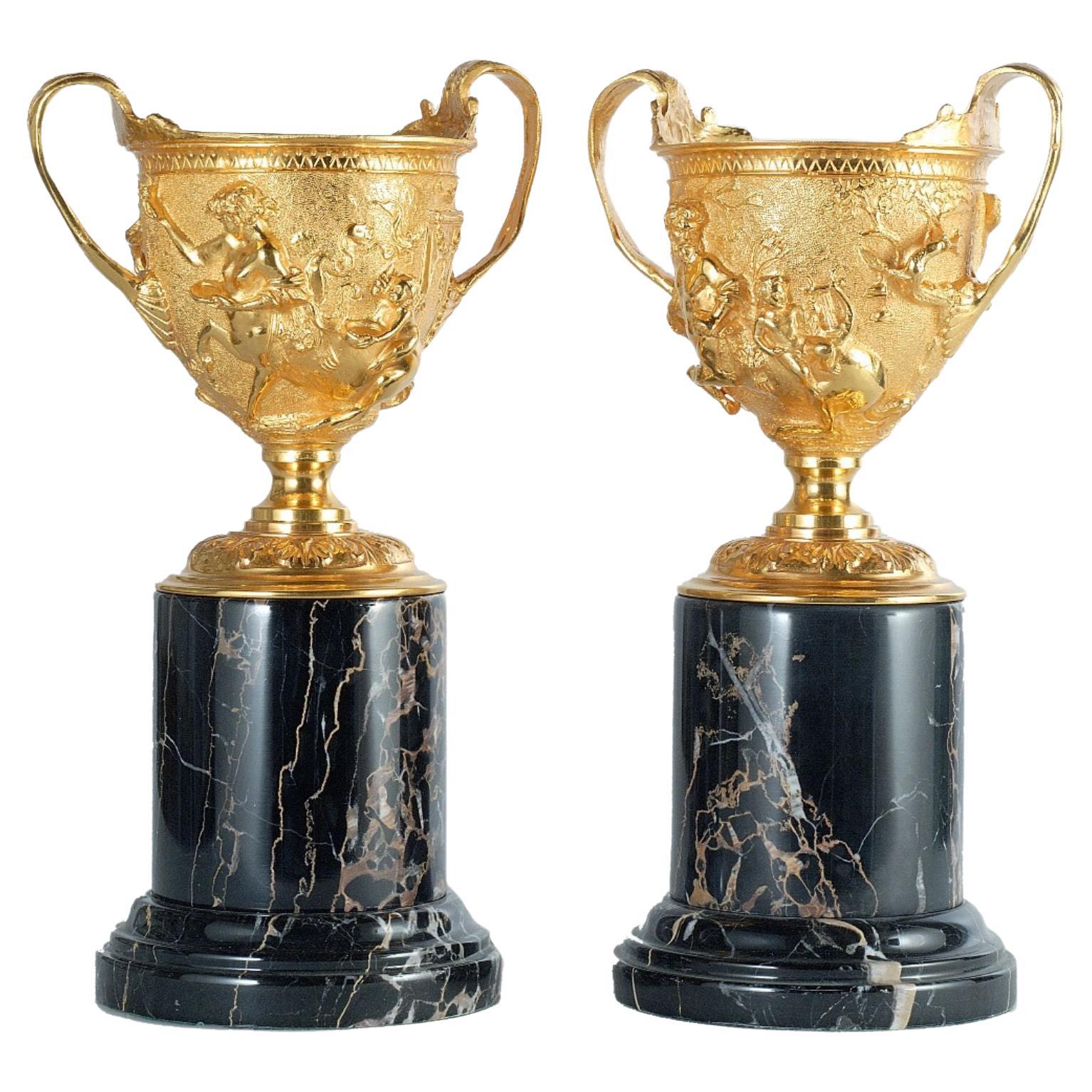 Hercules Satin brass cup with black marble base For Sale at 1stDibs