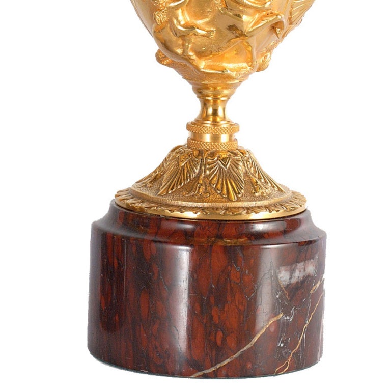 Hercules Satin brass cup with black marble base For Sale at 1stDibs
