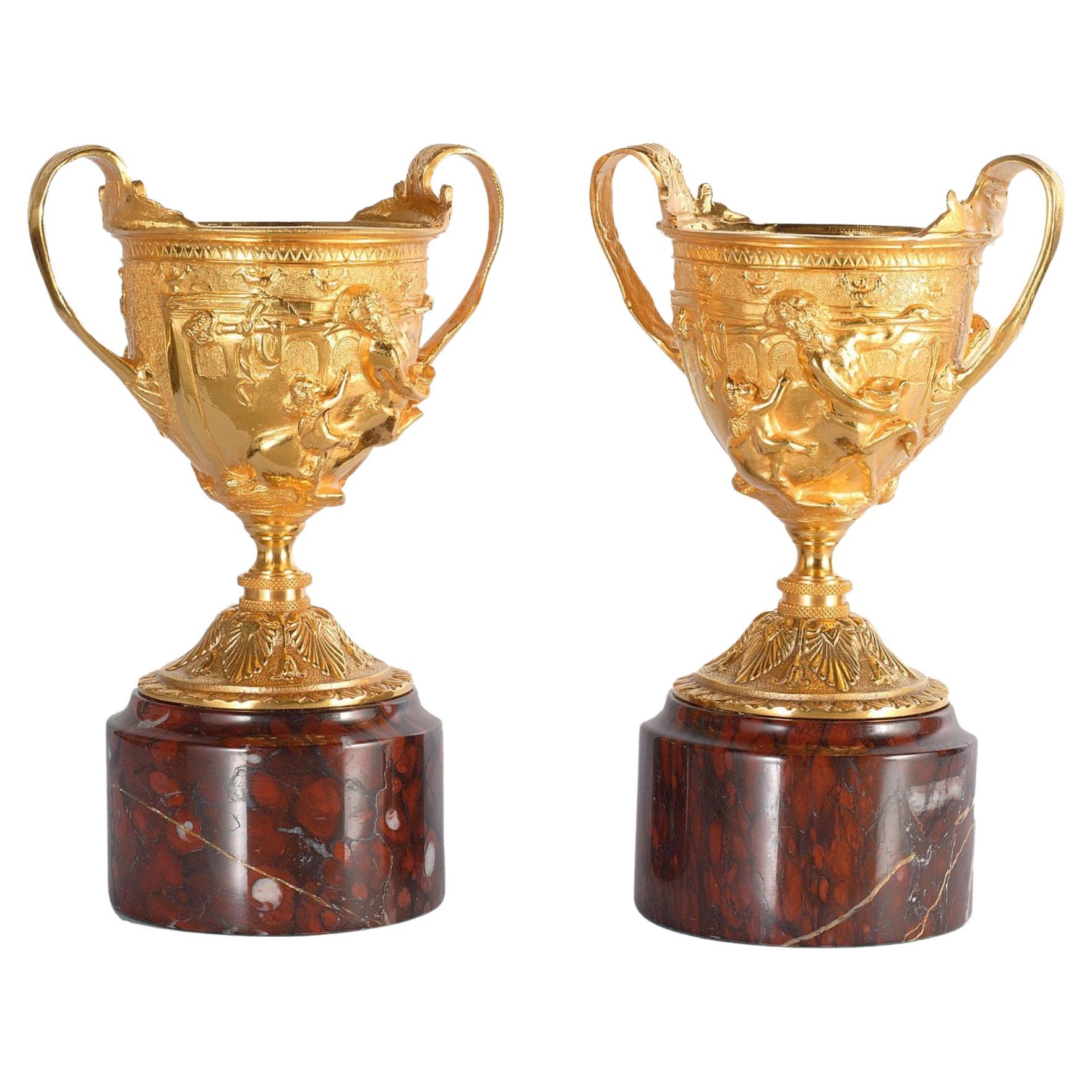 Hercules Satin brass cup with black marble base For Sale at 1stDibs