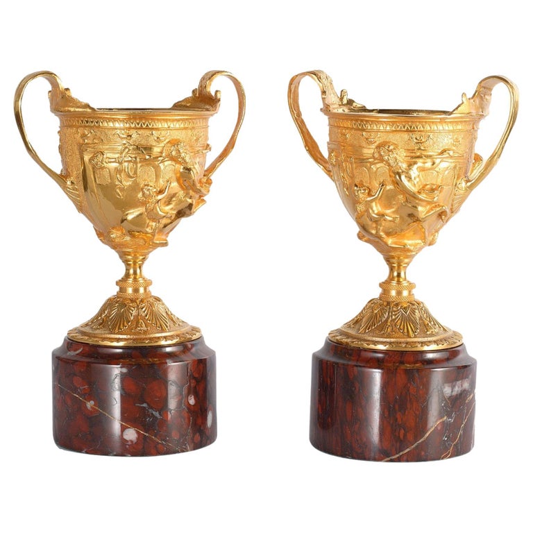 Hercules Satin brass cup with black marble base For Sale at 1stDibs