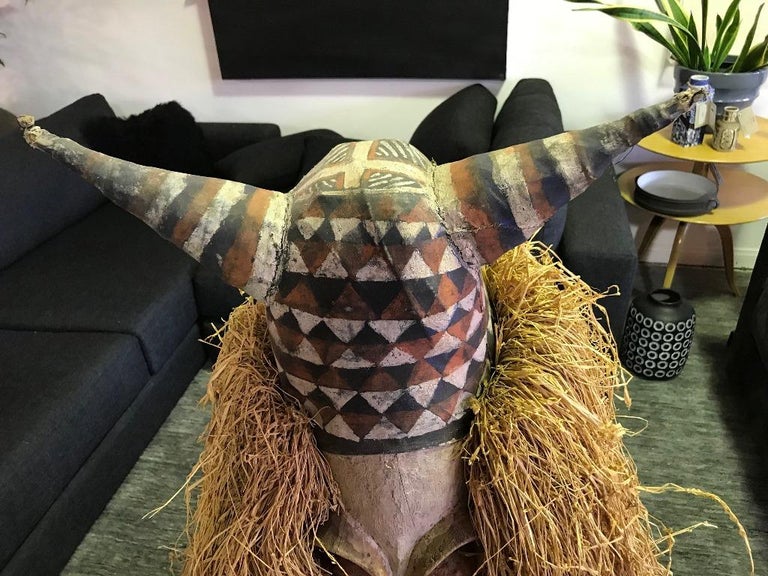 Decorative Large Adorned African Folk Art Mask with Horns on Display ...