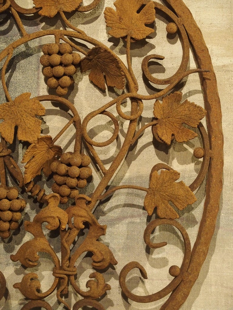 Decorative Oval Iron Wall Hanging with Scrolling Grape Vines at 1stDibs