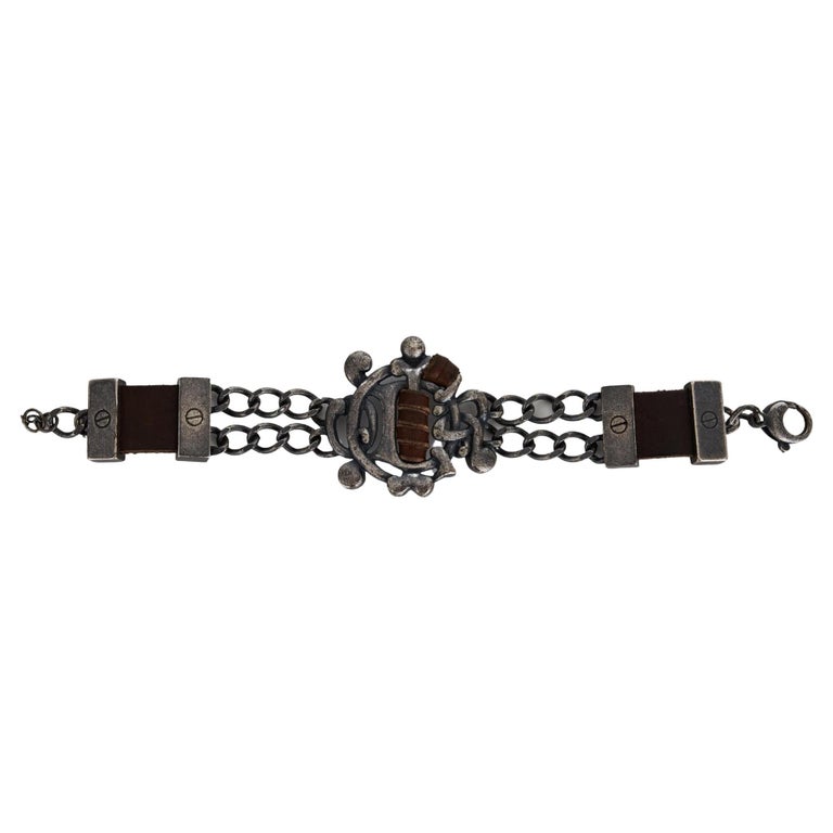 Dior Vintage Gun Metal Crest Logo Typographic Bracelet For Sale at 1stDibs