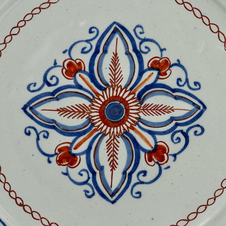 Dutch Delft Plate with Flower, 18th Century For Sale at 1stDibs