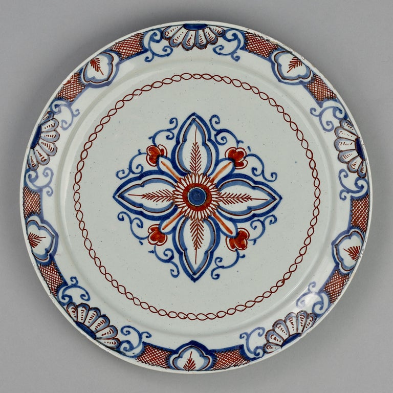 Dutch Delft Plate with Flower, 18th Century For Sale at 1stDibs