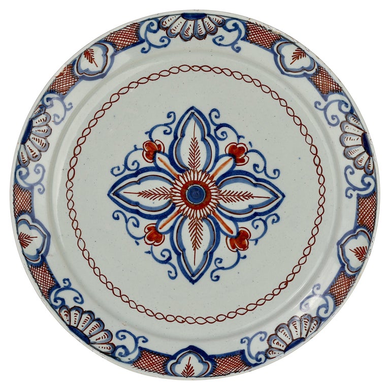 Dutch Delft Plate with Flower, 18th Century For Sale at 1stDibs