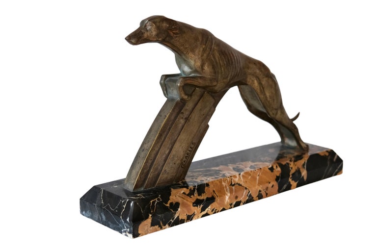 Dynamic Bronze Greyhound Sculpture with Vintage Patina on a Portor ...
