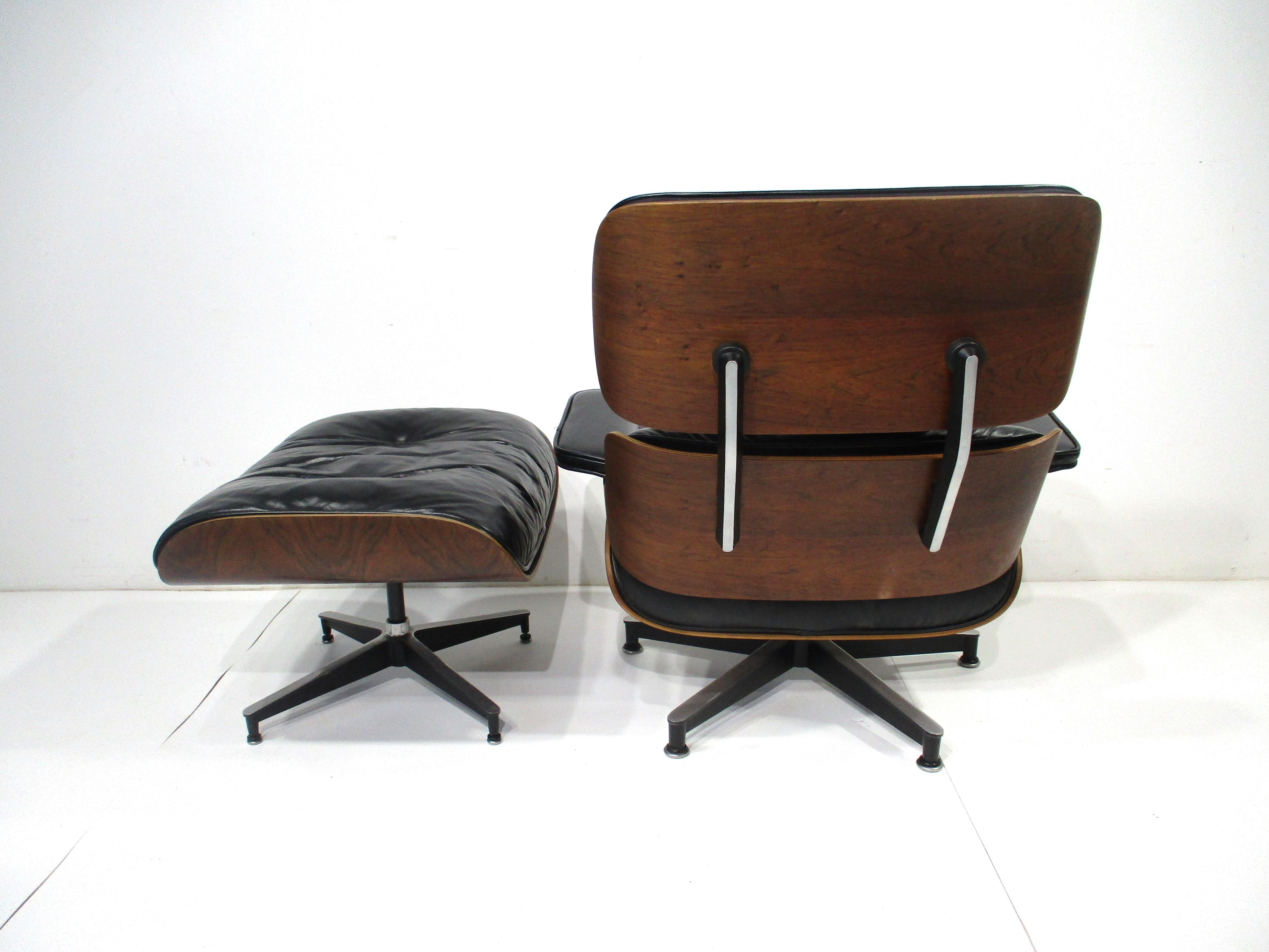 Eames 670 Rosewood Leather Lounge Chair with Ottoman at 1stDibs