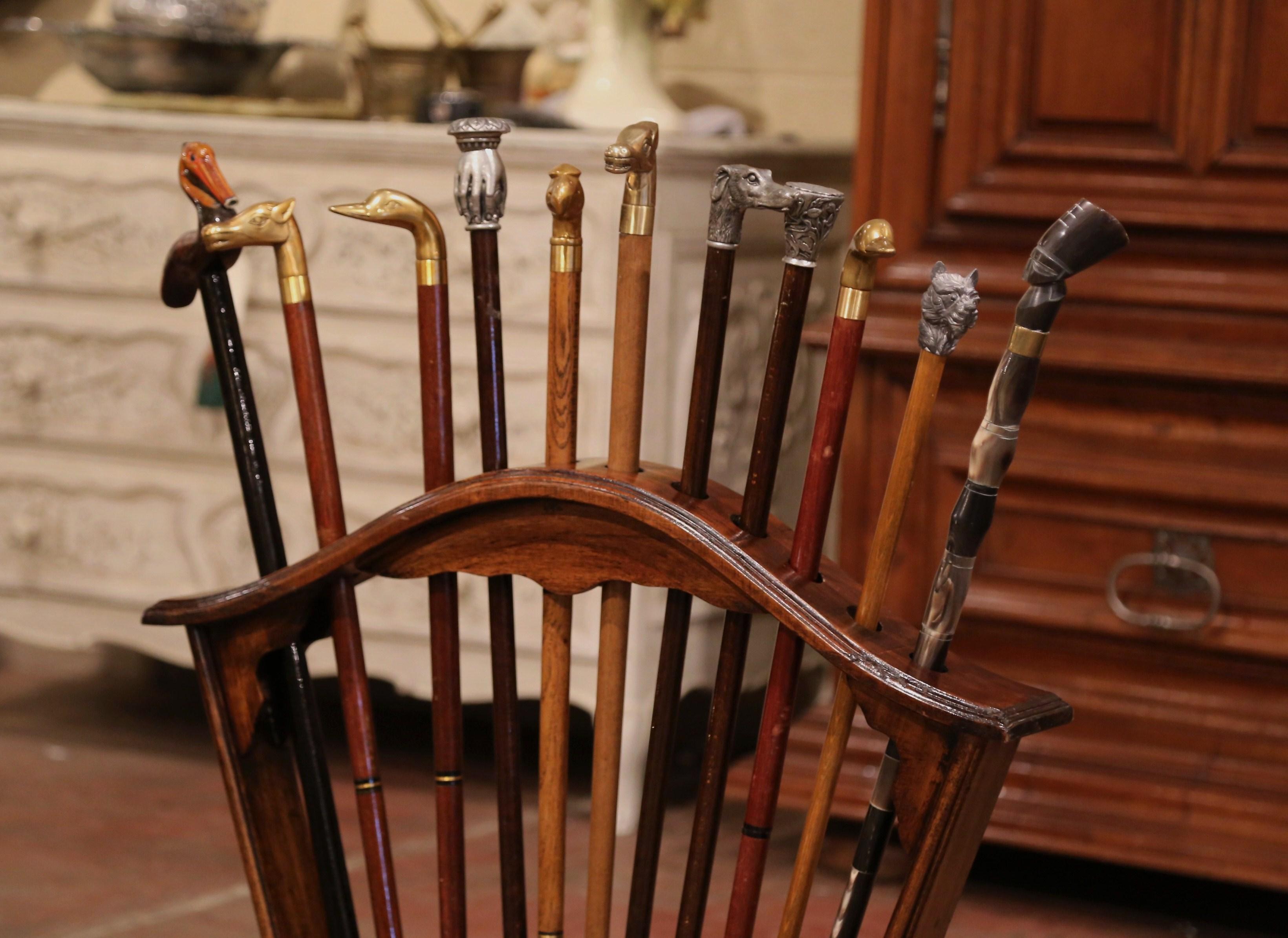Early 20th Century French Carved Walnut Cane Stand with Eleven Antique ...