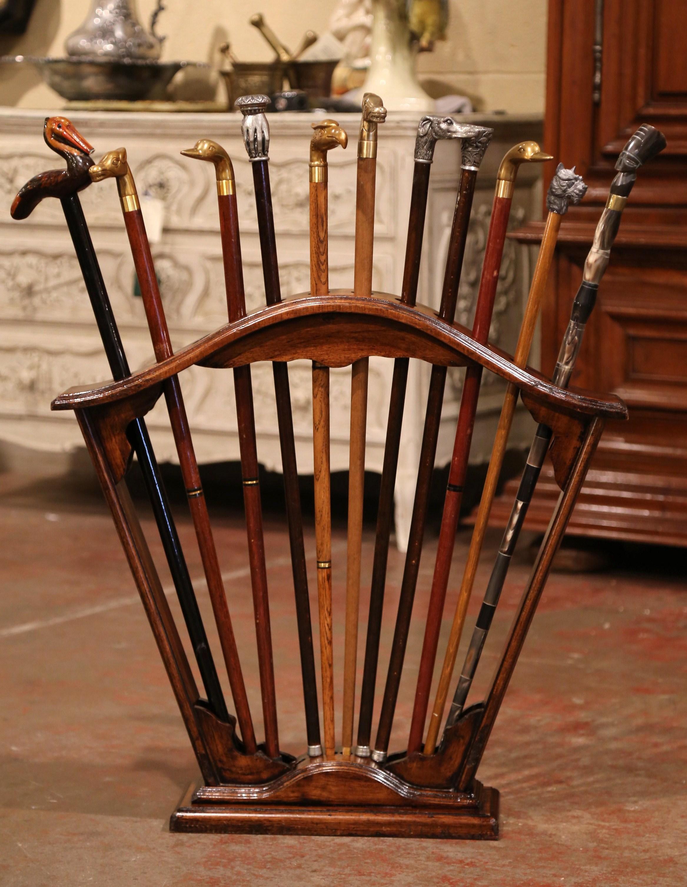 Early 20th Century French Carved Walnut Cane Stand with Eleven Antique ...