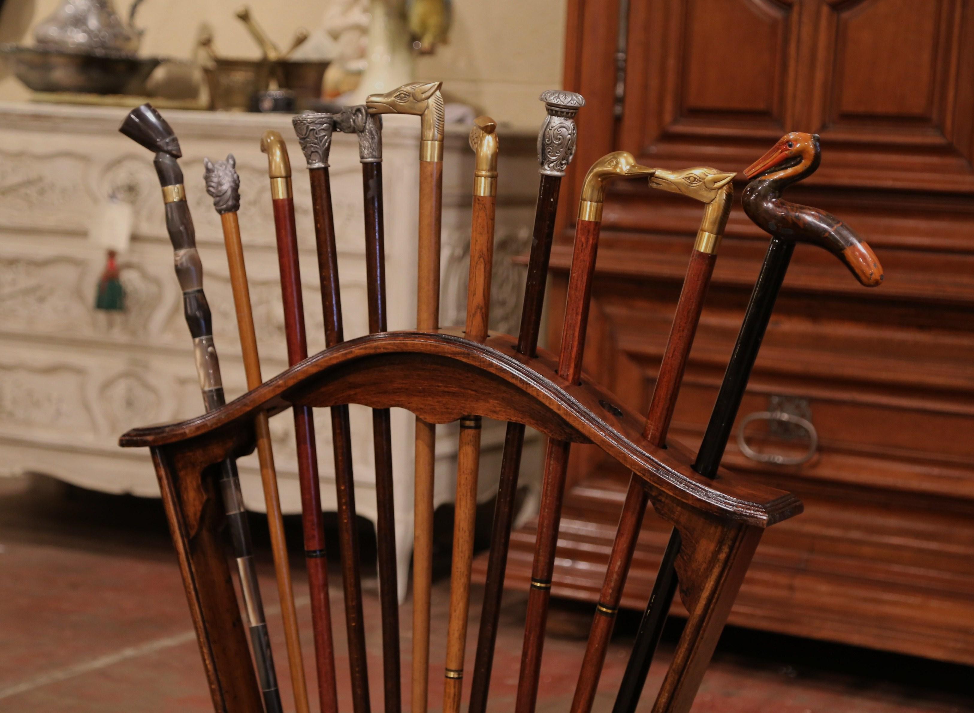Early 20th Century French Carved Walnut Cane Stand with Eleven Antique ...