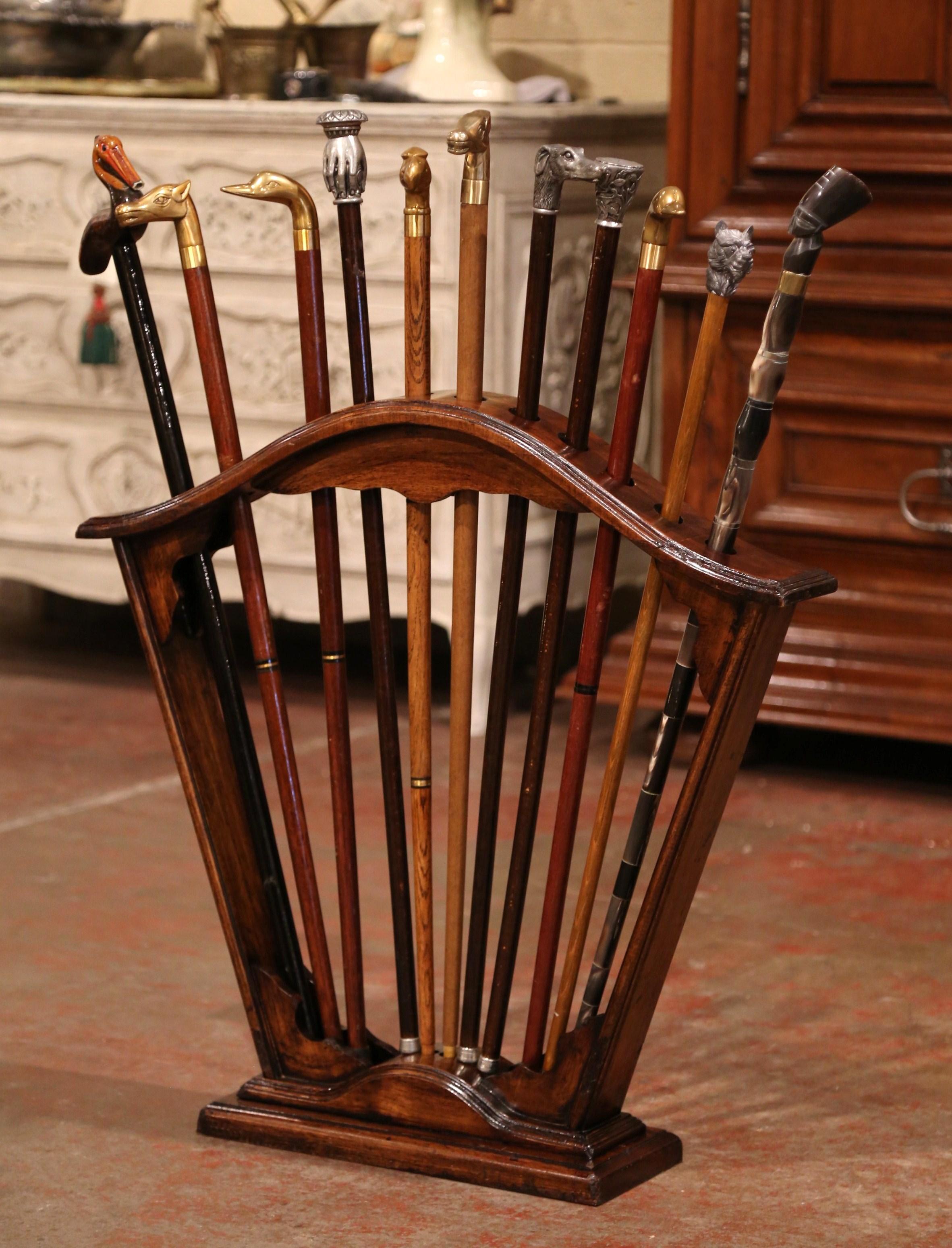 Early 20th Century French Carved Walnut Cane Stand with Eleven Antique ...
