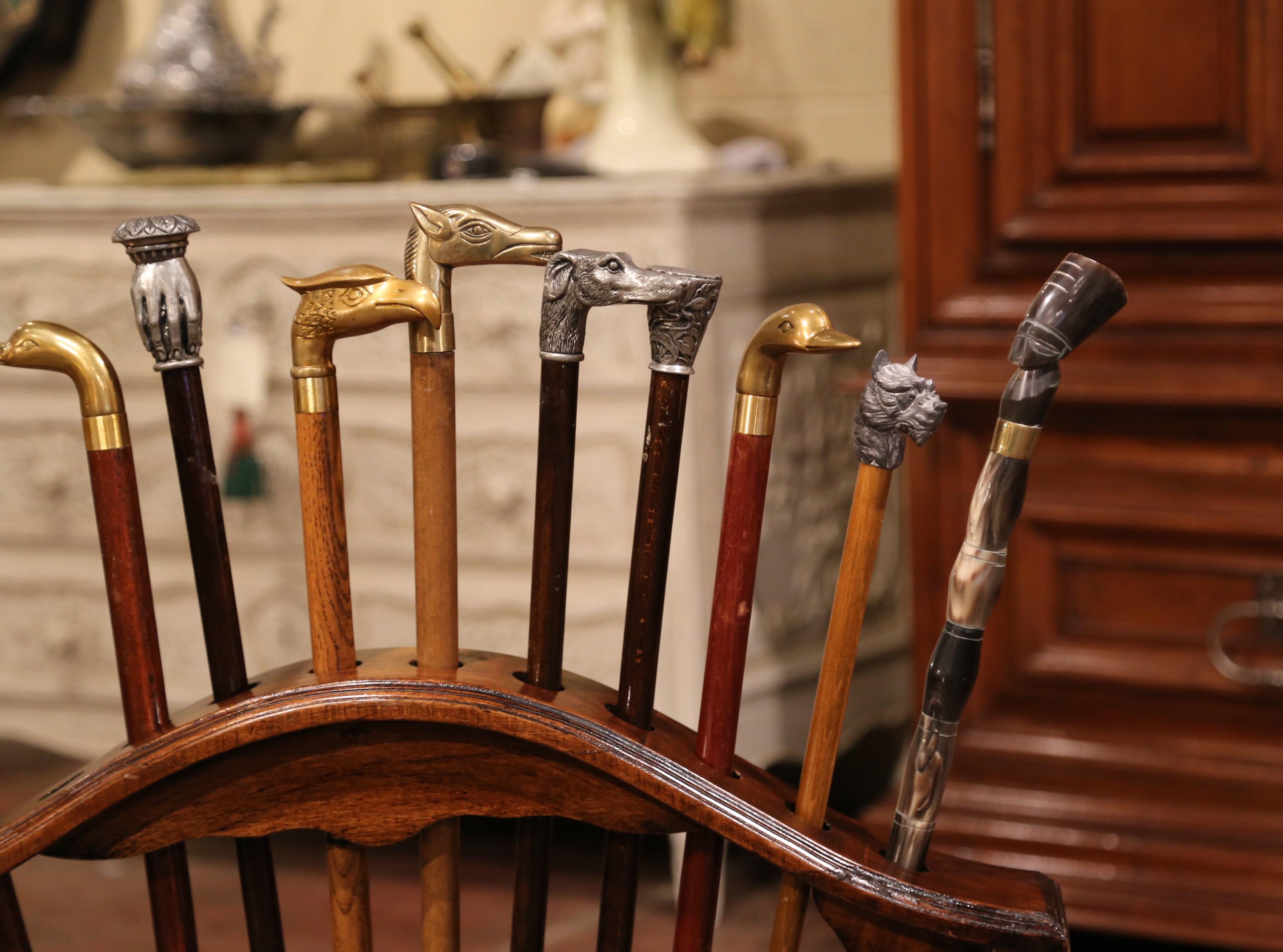 Early 20th Century French Carved Walnut Cane Stand with Eleven Antique ...